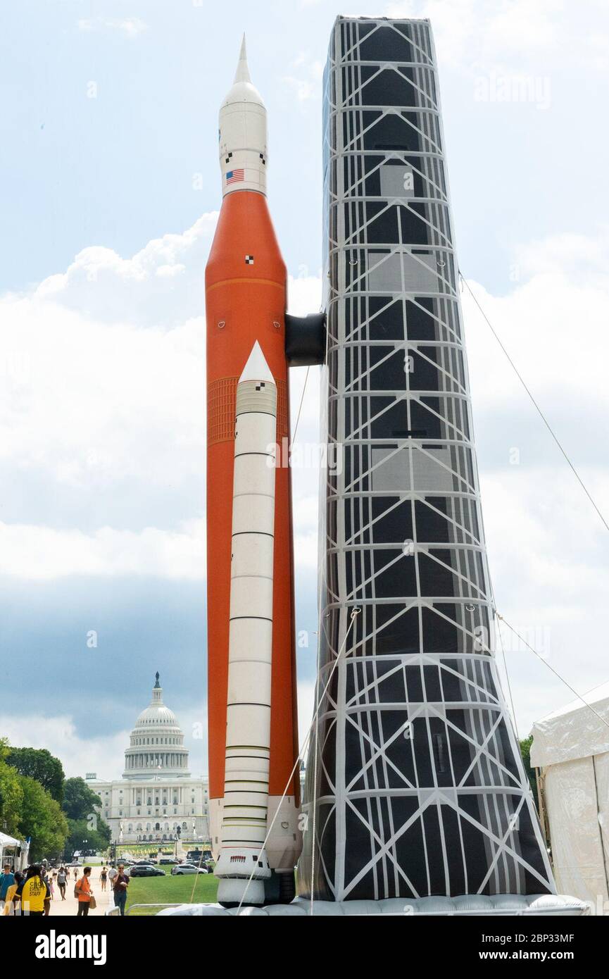 A large inflatable Space Launch System (SLS) rocket is displayed at the ...