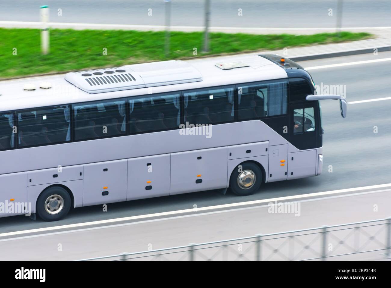 Large comfortable long-distance bus rides on the highway Stock Photo ...