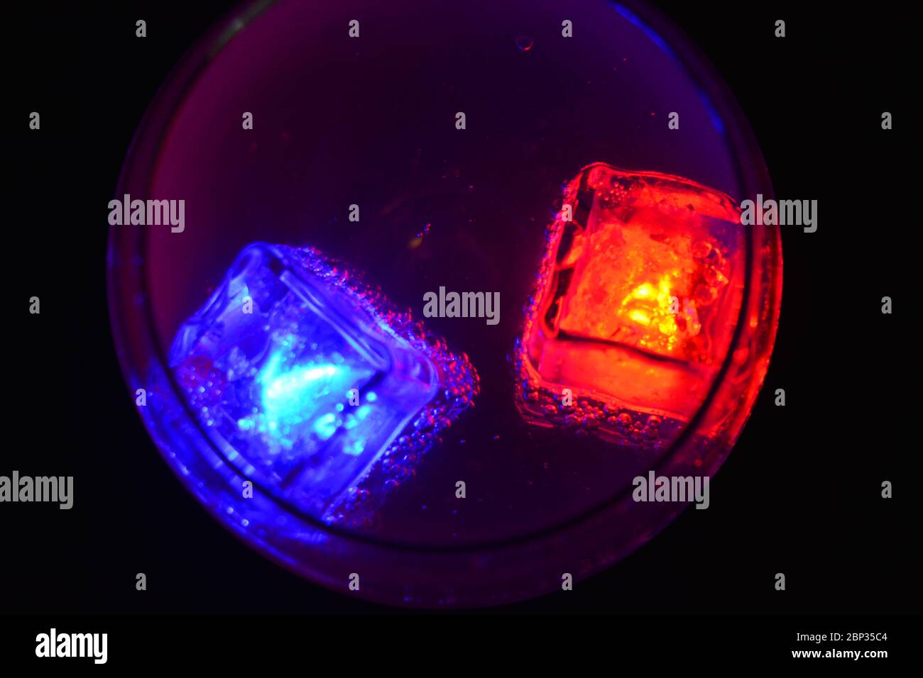 Red and blue bright glowing ice cubes that float in a delicious frosted ...