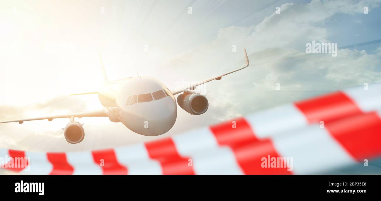 Plane on sky closed warning tape Stock Photo - Alamy