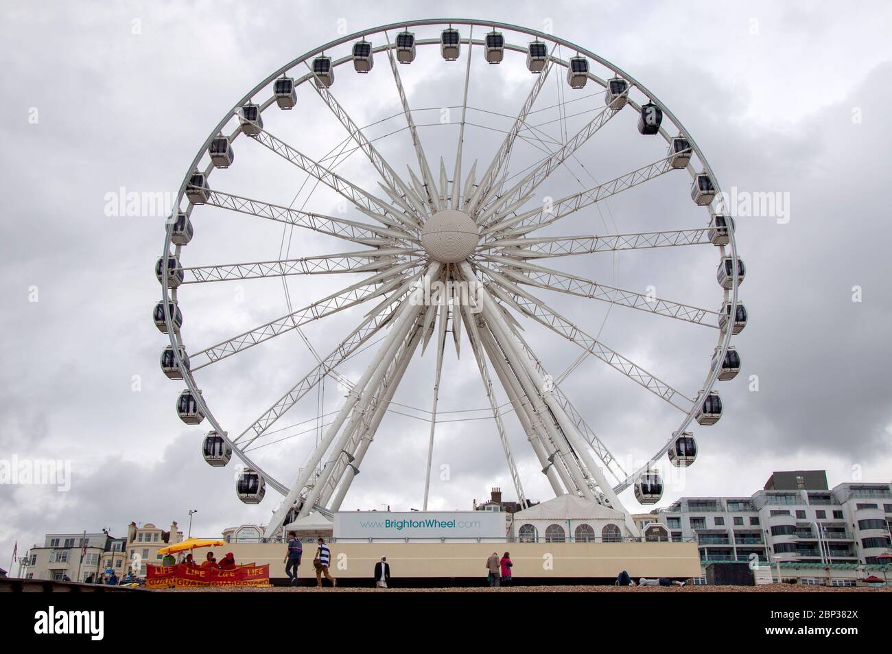 The Brighton Wheel as seen from the Kemptown pebble beach seafront in ...