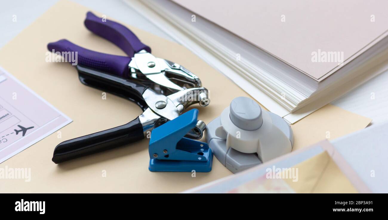 Decorating tool and stack of sheets for making envelopes Stock Photo ...