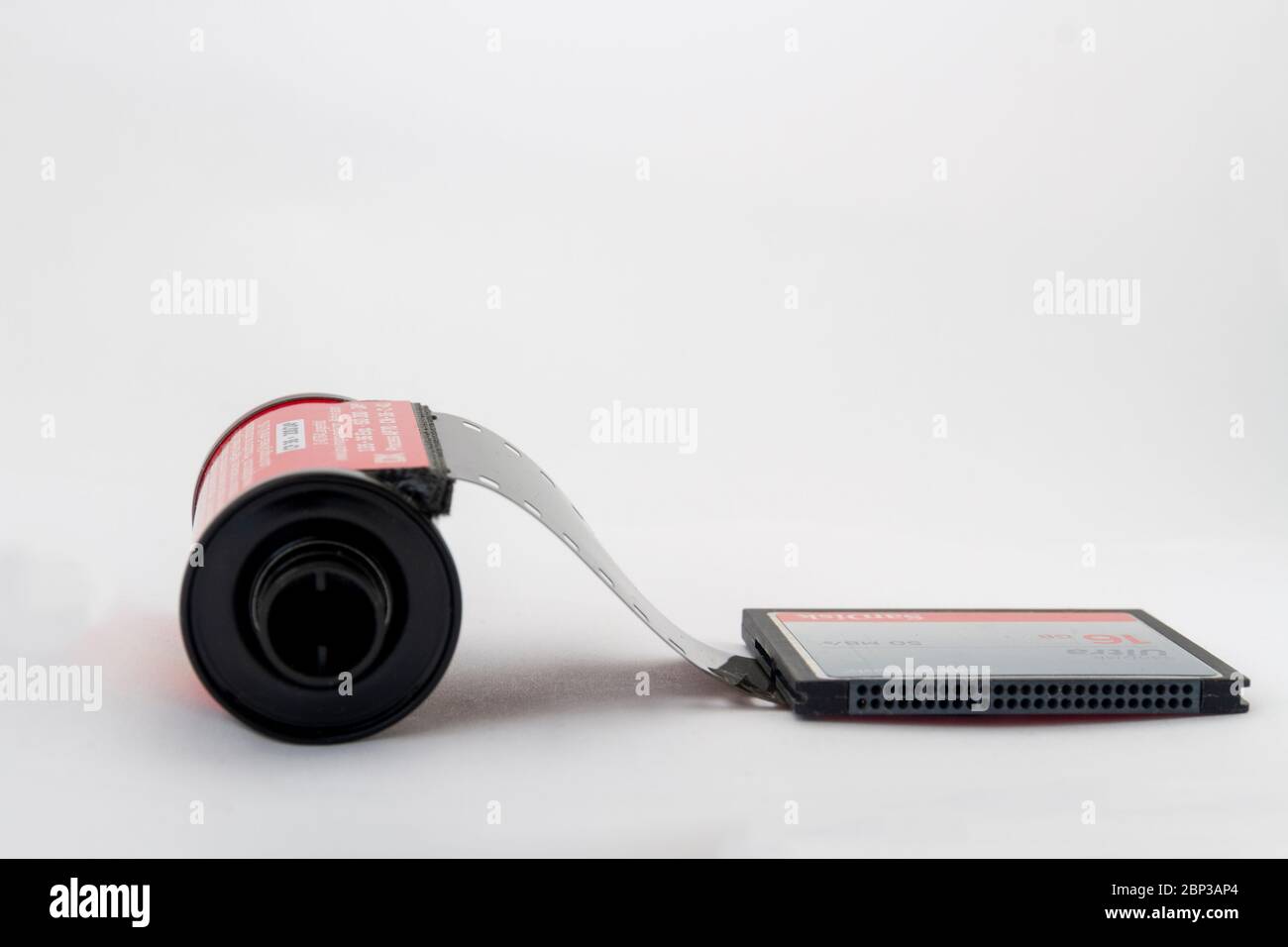 35mm film rolling out of cassette to a 16GB memory card as if the two ...