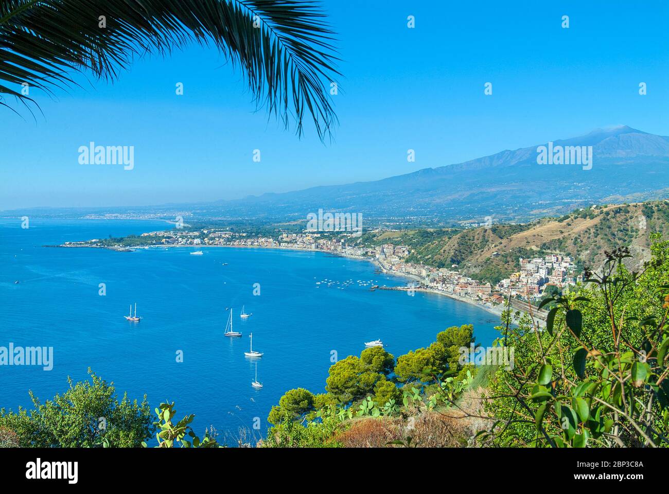 Giardini Naxos with Mount Etna behind, from Taormina, Sicily, Italy ...