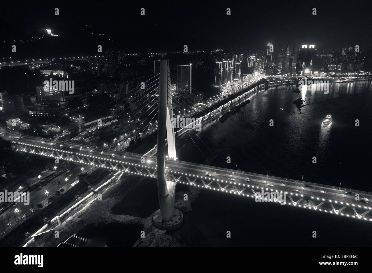 Aerial view of Bridge and city urban architecture at night in Chongqing ...