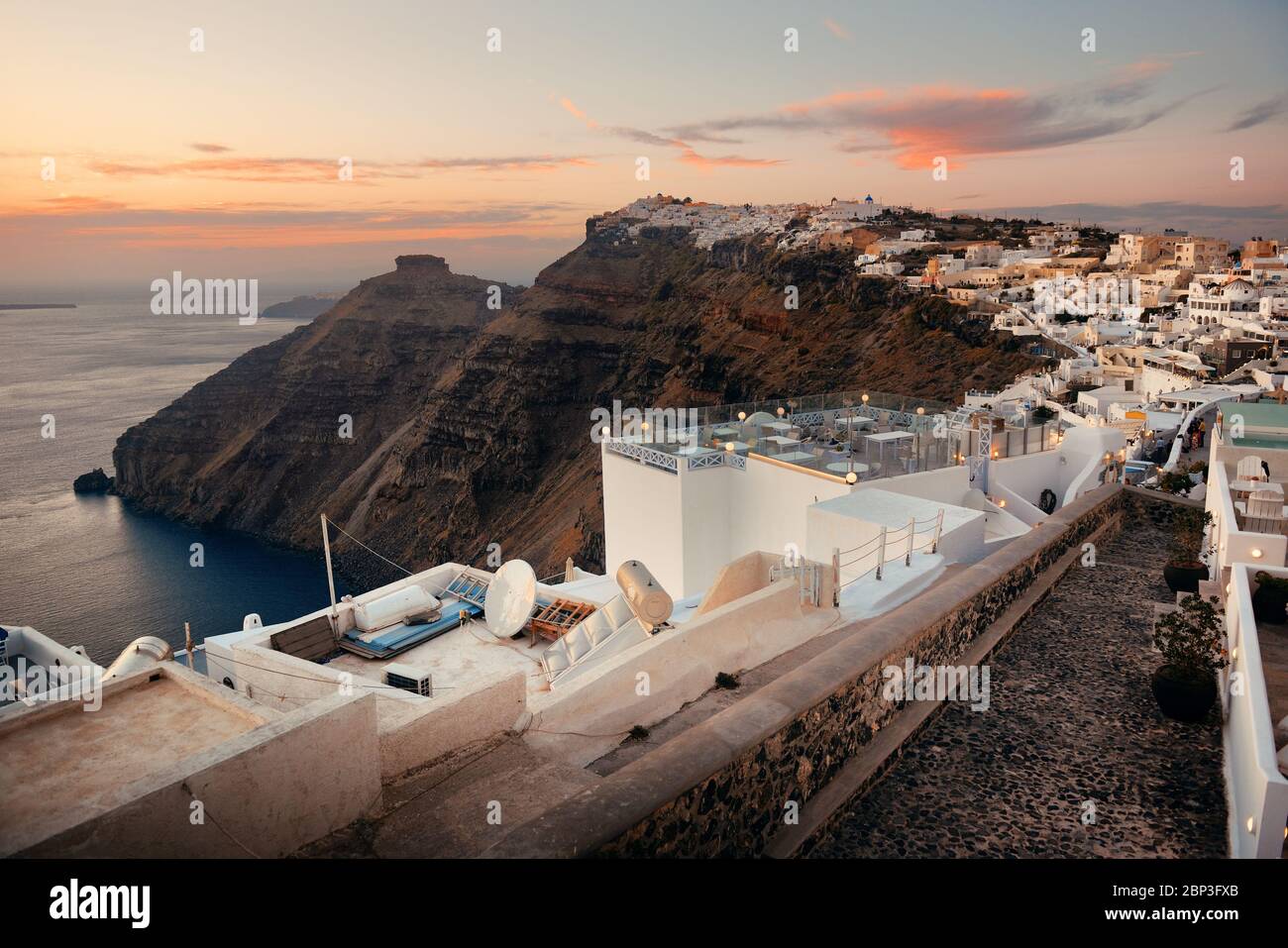 Santorini skyline sunset with buildings in Greece Stock Photo - Alamy