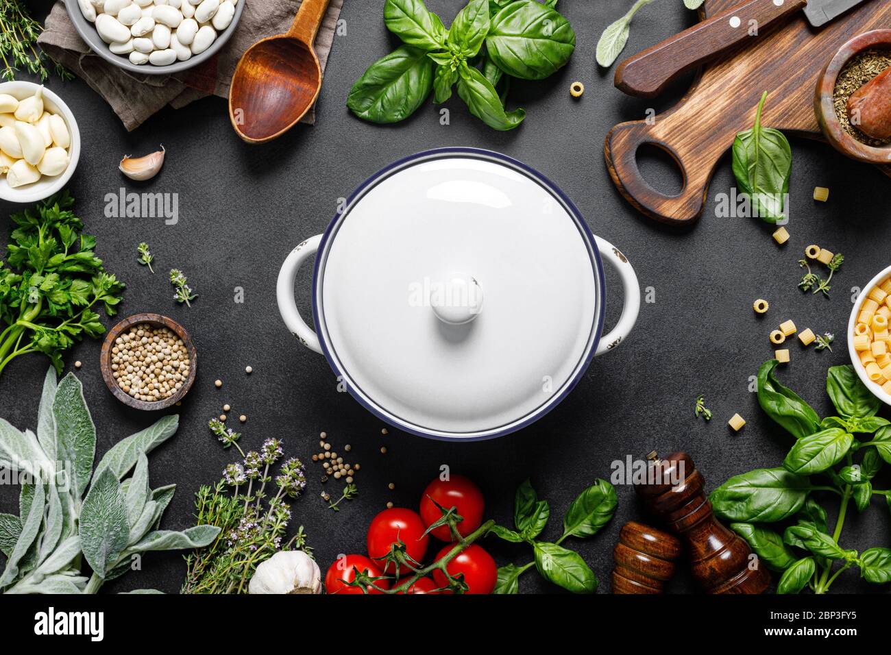 Culinary background with ingredients for cooking, herbs and spices ...