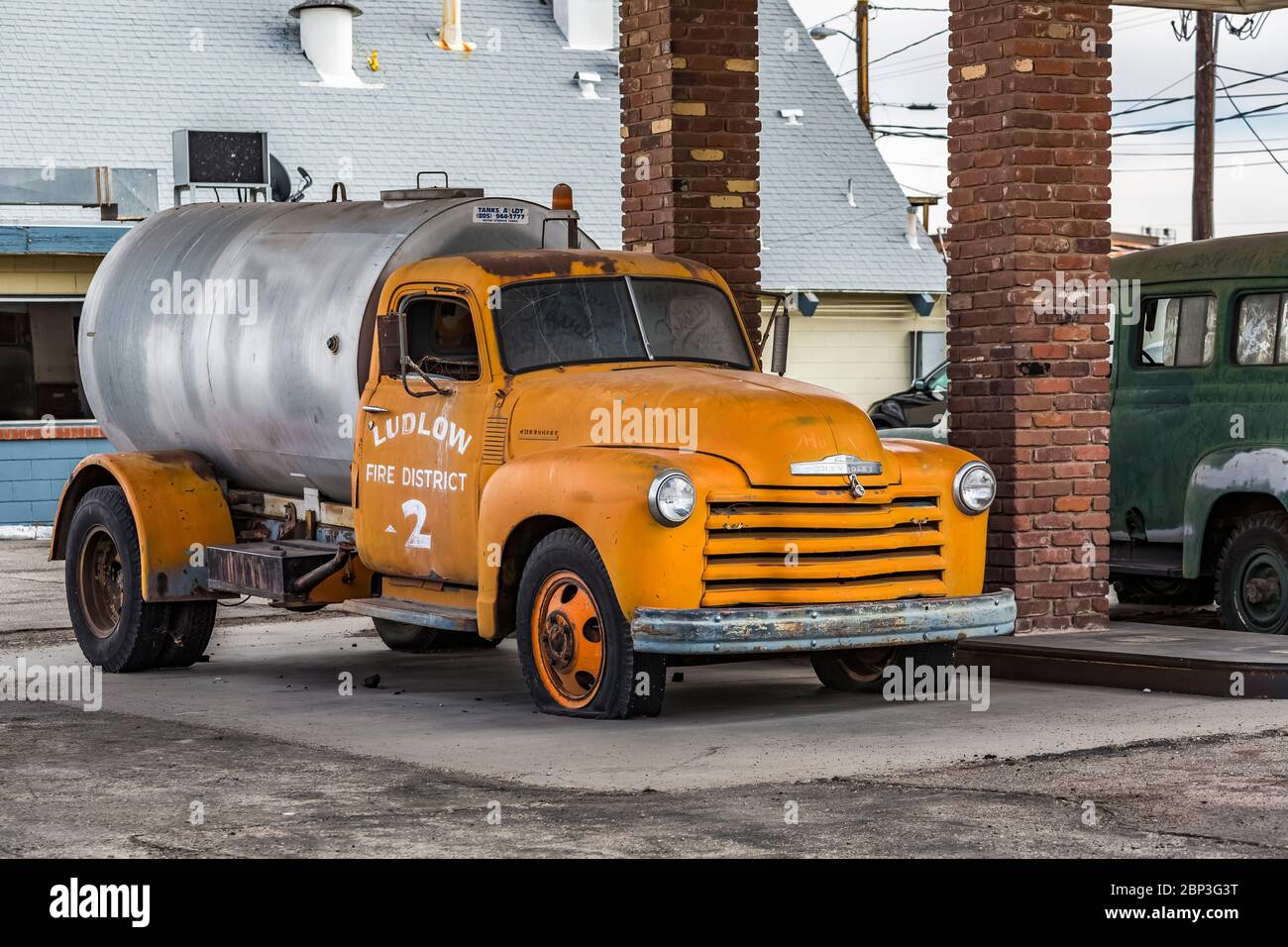 Old Chevrolet water tanker firetruck at a vintage gas station along ...