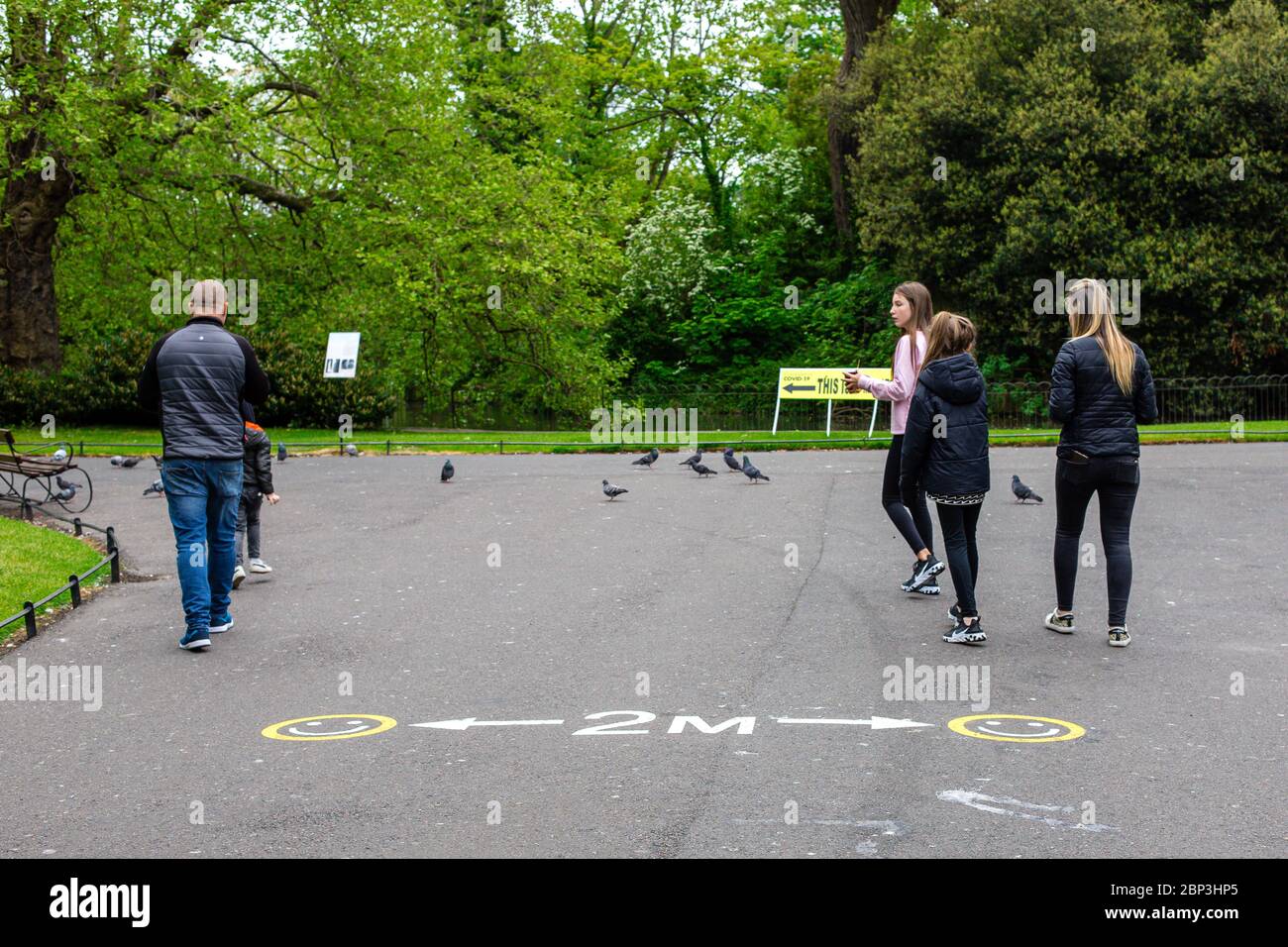 Social distancing measures in St. Stephen`s Green Park in Dublin ...