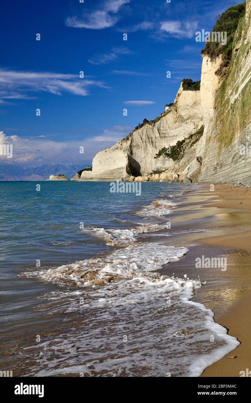 Logas Beach with azure water and amazing rocky cliff in Peroulades ...