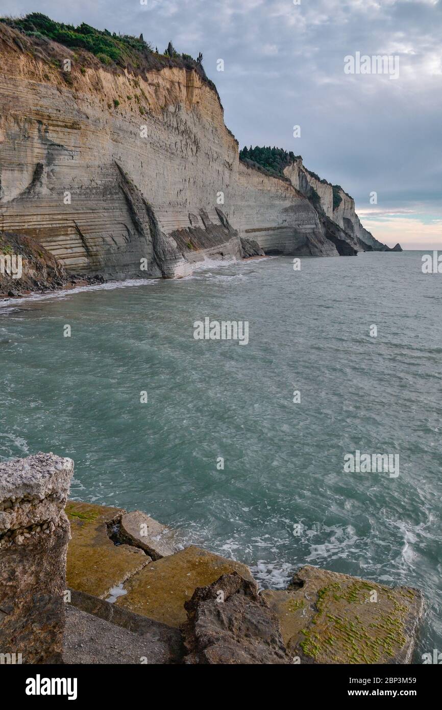 Logas Beach with azure water and amazing rocky cliff in Peroulades ...