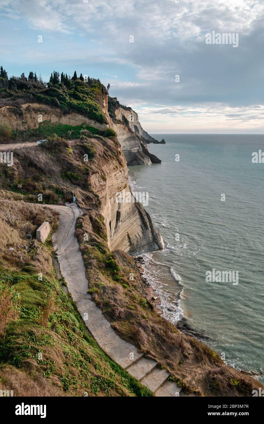 Logas Beach with azure water and amazing rocky cliff in Peroulades ...