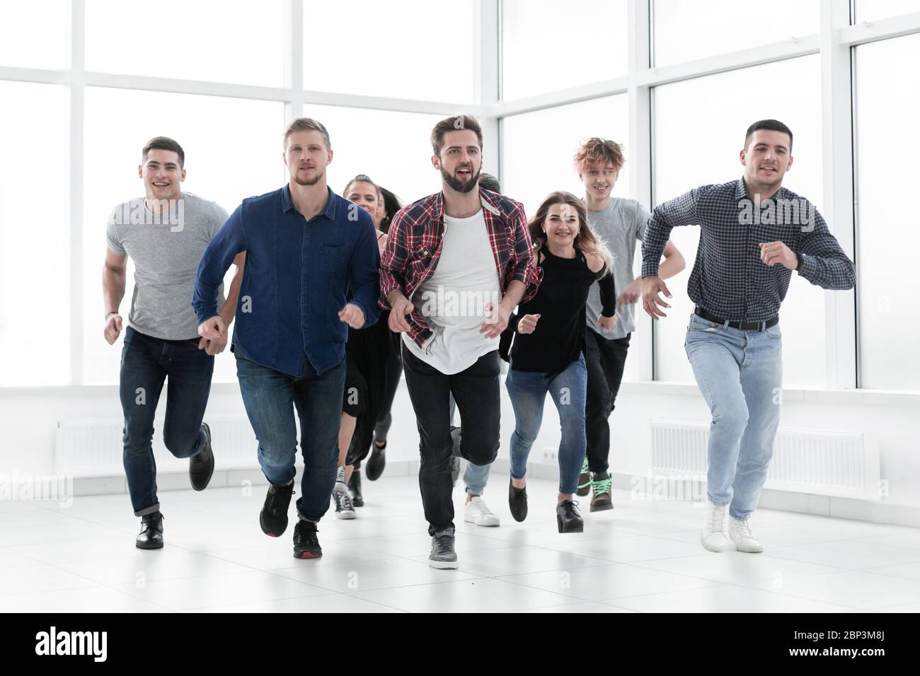 group of diverse young people running forward Stock Photo - Alamy