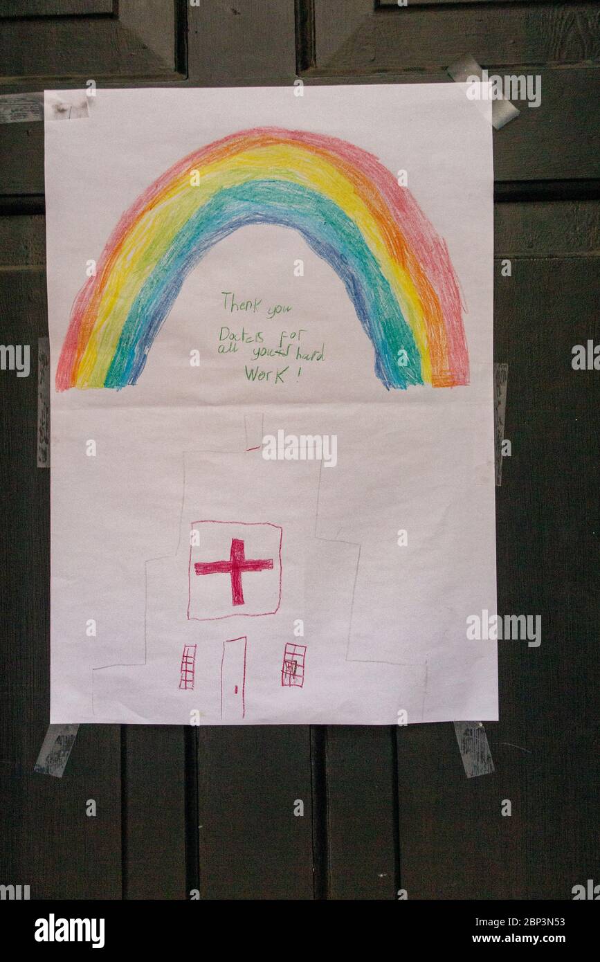 Rainbow pictures on display in a window with the words "thank you ...