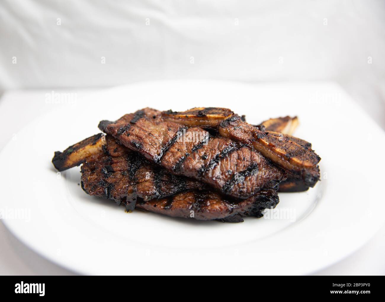Traditional Korean barbecue short rib on white plate Stock Photo - Alamy