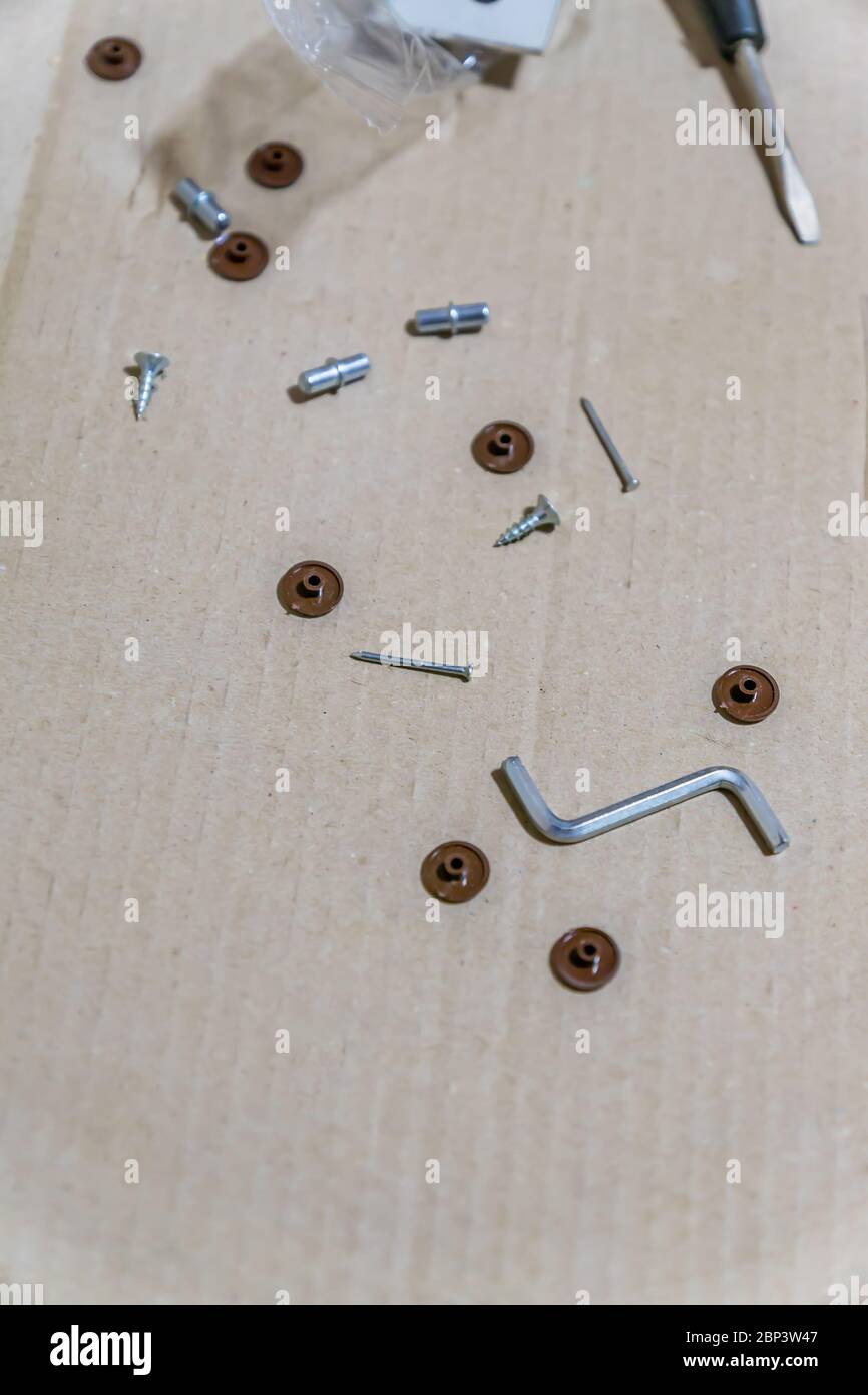 Furniture assembly parts and tools for self assembly Stock Photo - Alamy