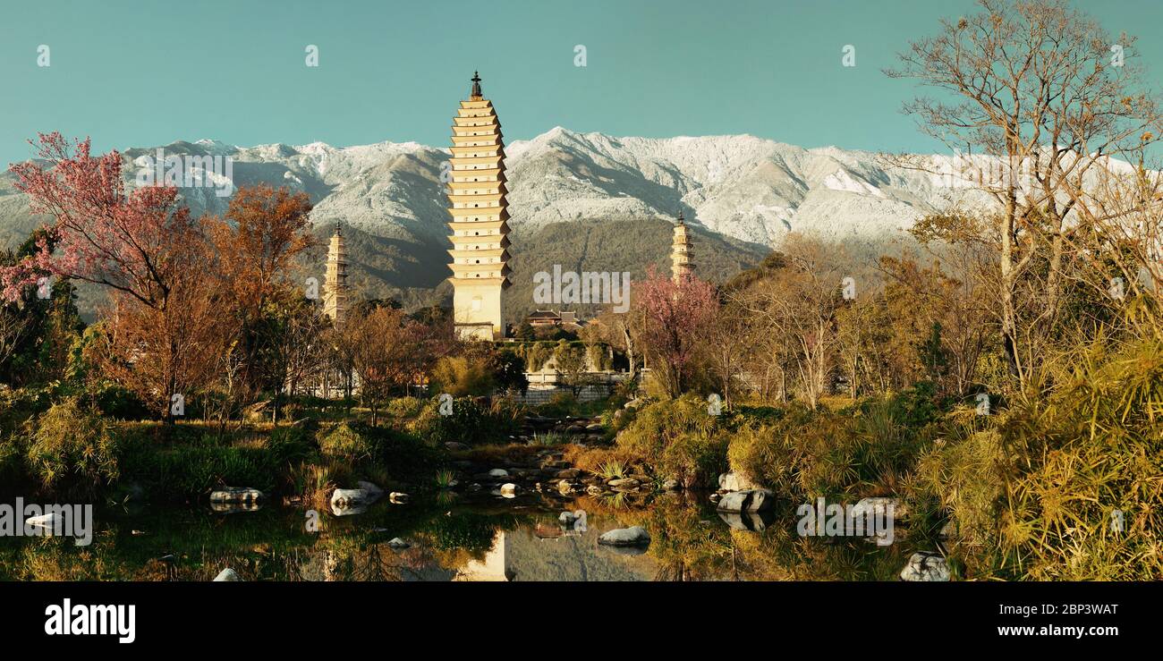 Ancient pagoda in Dali old town with snow capped Mt Cangshan, Yunnan ...