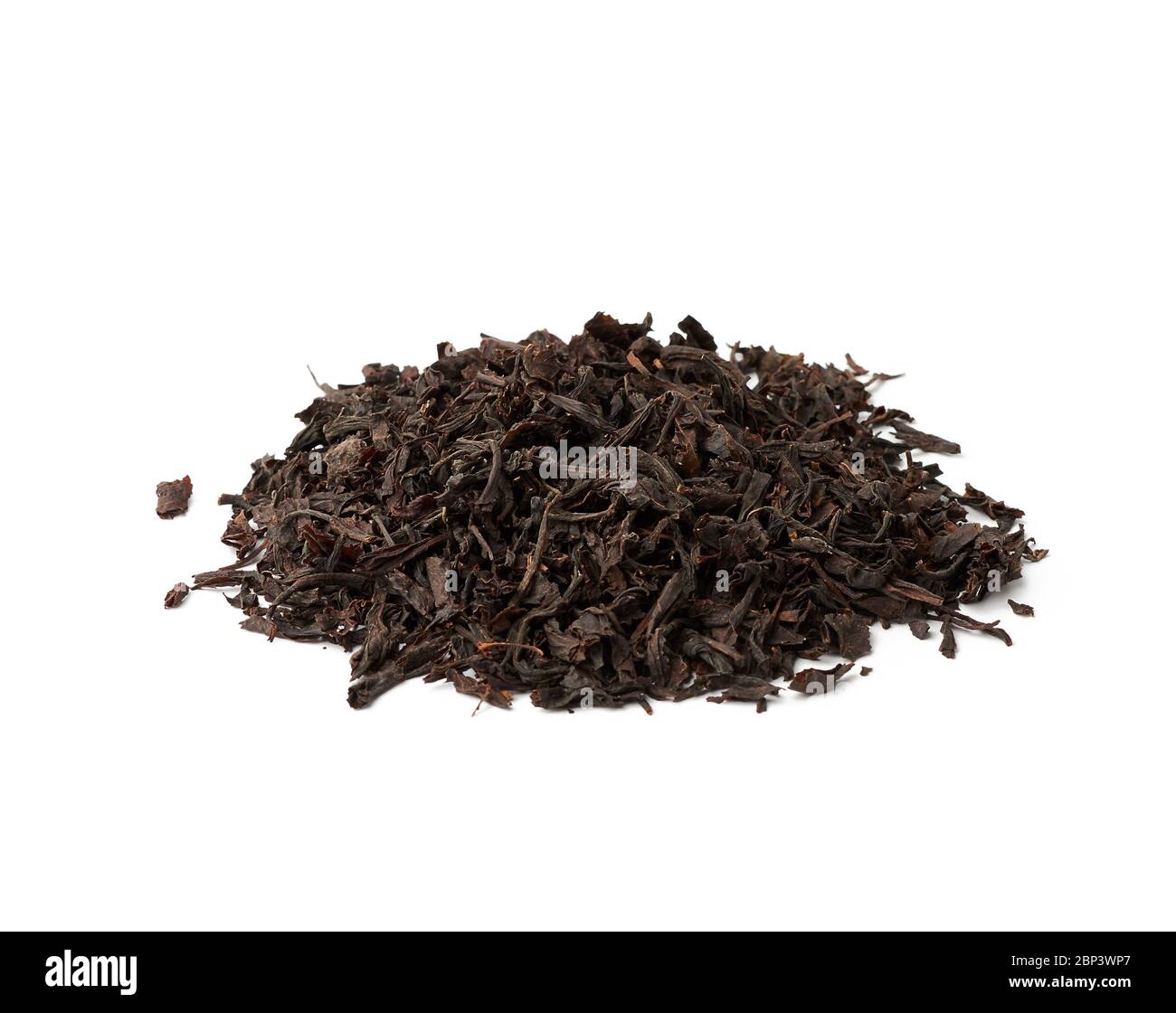 dry black long leaf tea, top view, ingredients for a hot drink, close ...