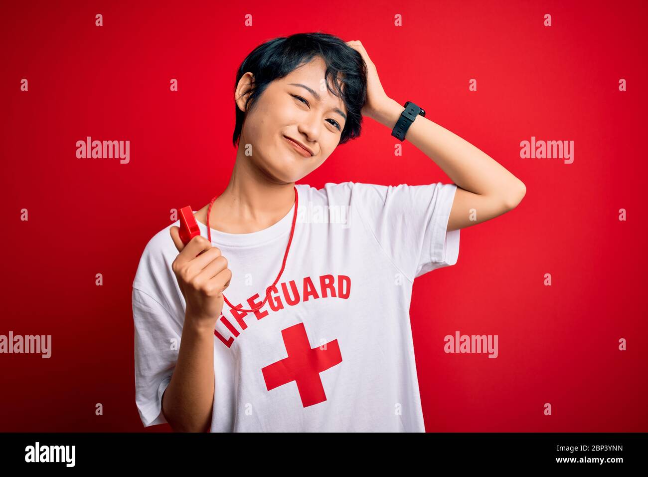 Young beautiful asian lifeguard girl wearing t-shirt with red cross ...