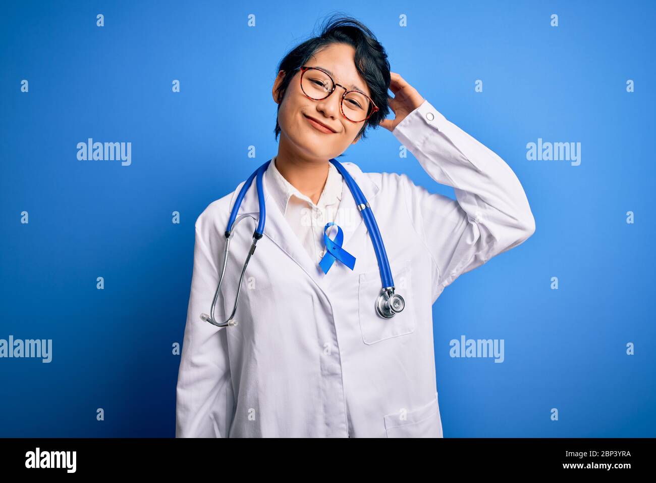 Young beautiful asian doctor girl wearing stethoscope and coat with ...