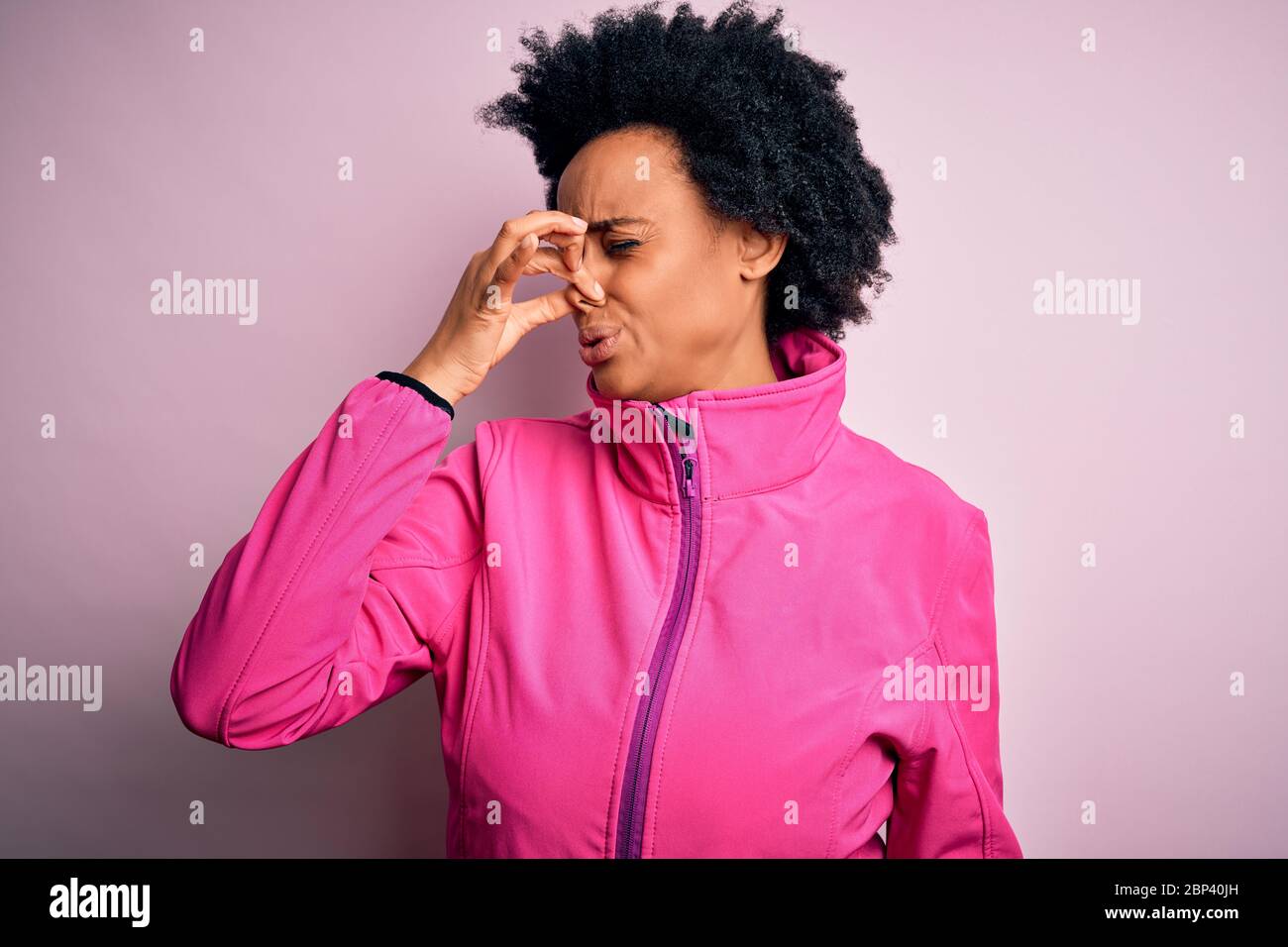 Young African American afro sportswoman with curly hair wearing ...