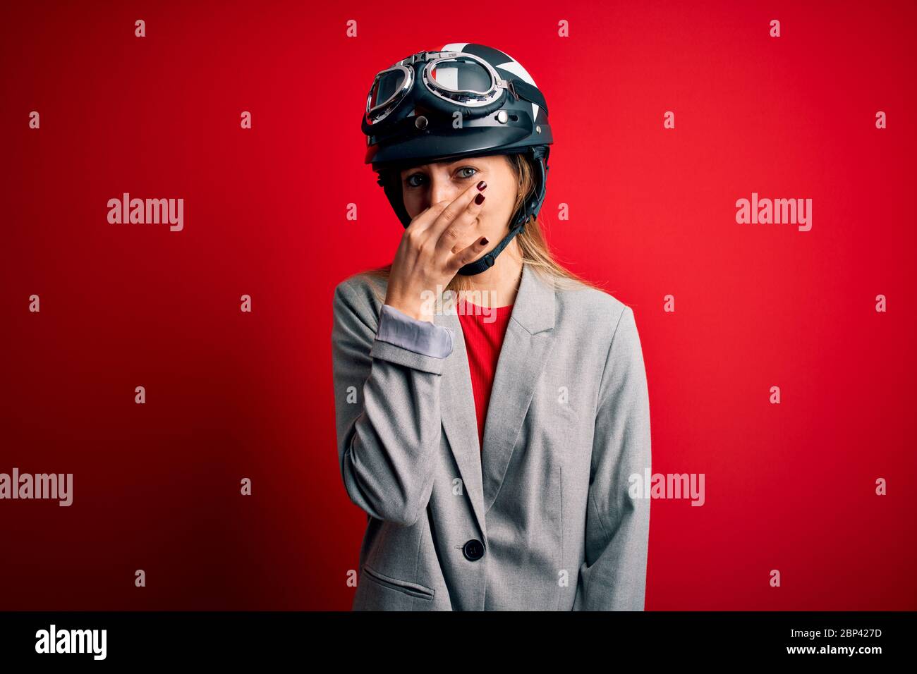 Young woman wearing dirty motorcycle helmet hi-res stock photography ...