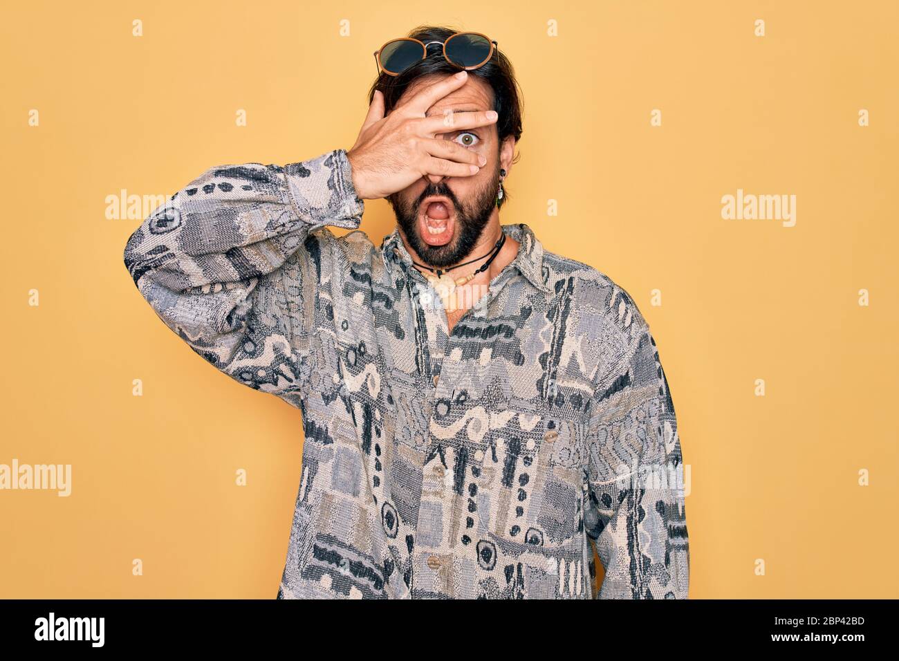 Young handsome hispanic bohemian man wearing hippie style and ...