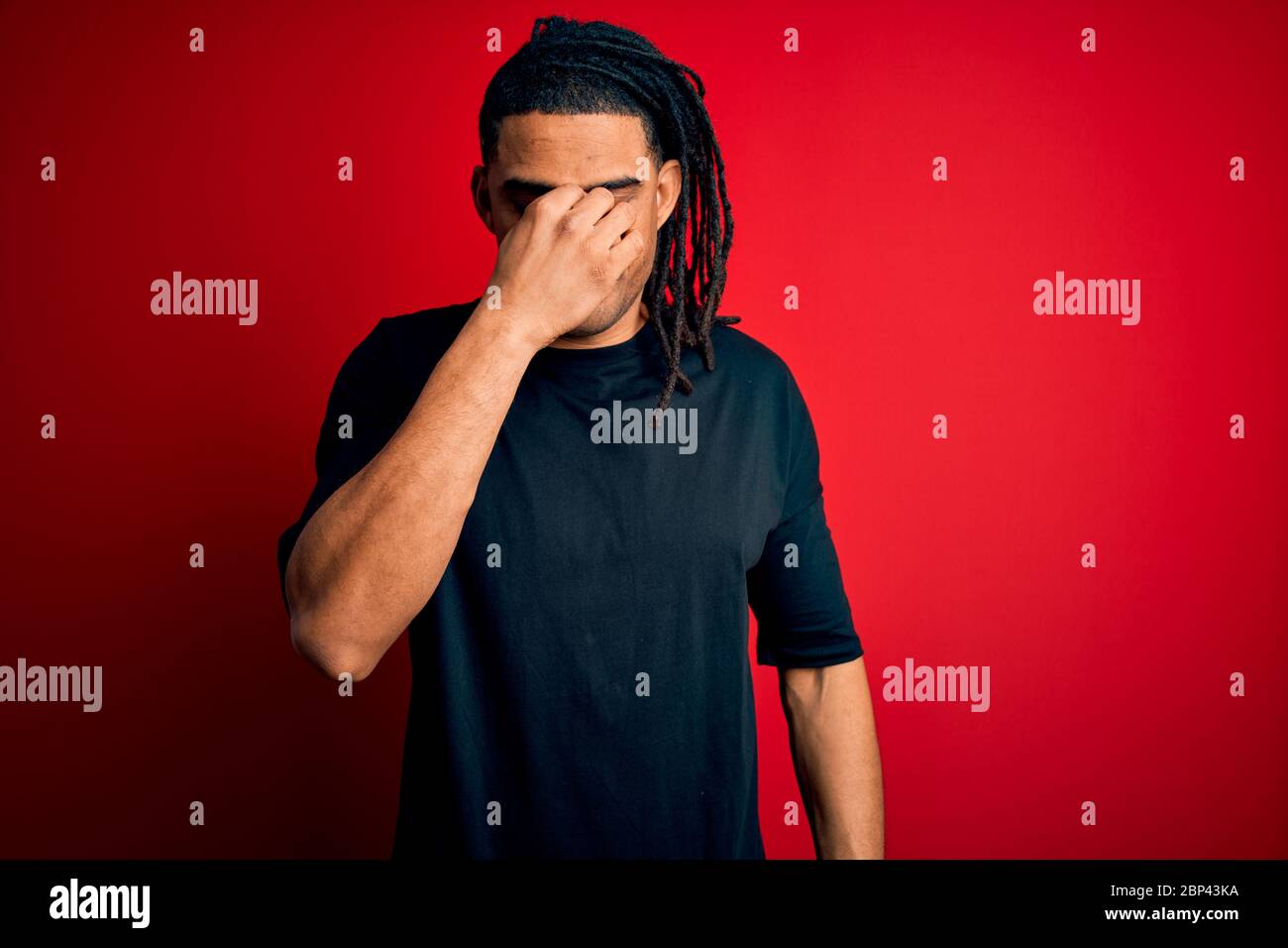 Young handsome african american afro man with dreadlocks wearing casual ...