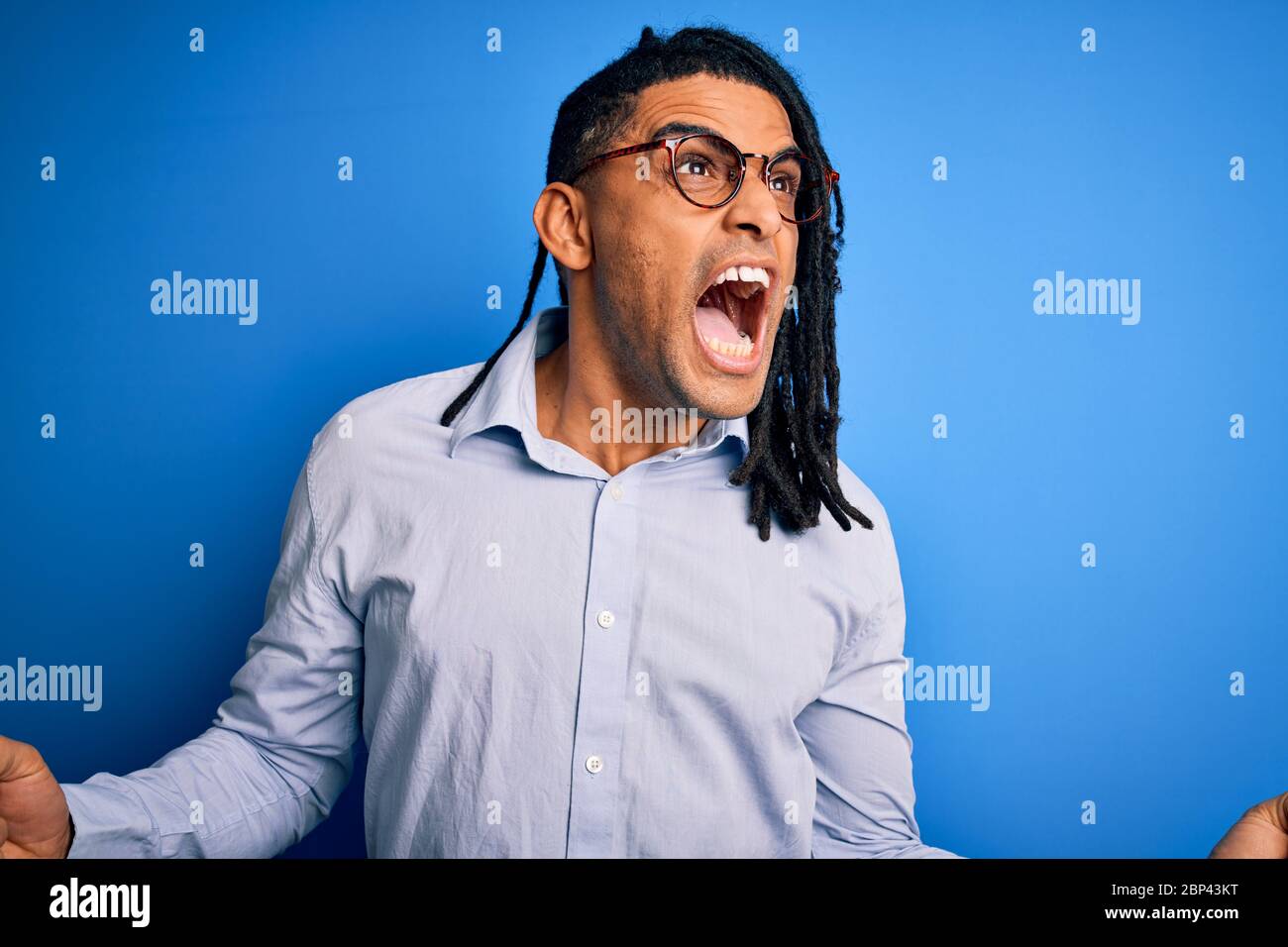 Young handsome african american man with dreadlocks wearing casual ...