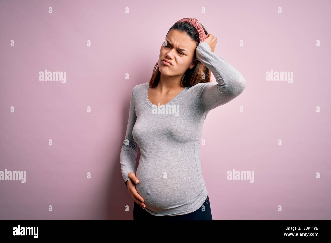 Young beautiful teenager girl pregnant expecting baby over isolated ...