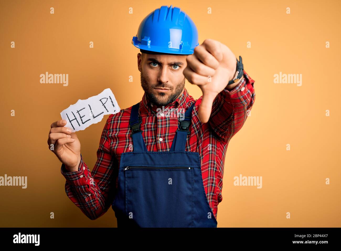 Young builder man wearing safety helmet offering help and support over ...