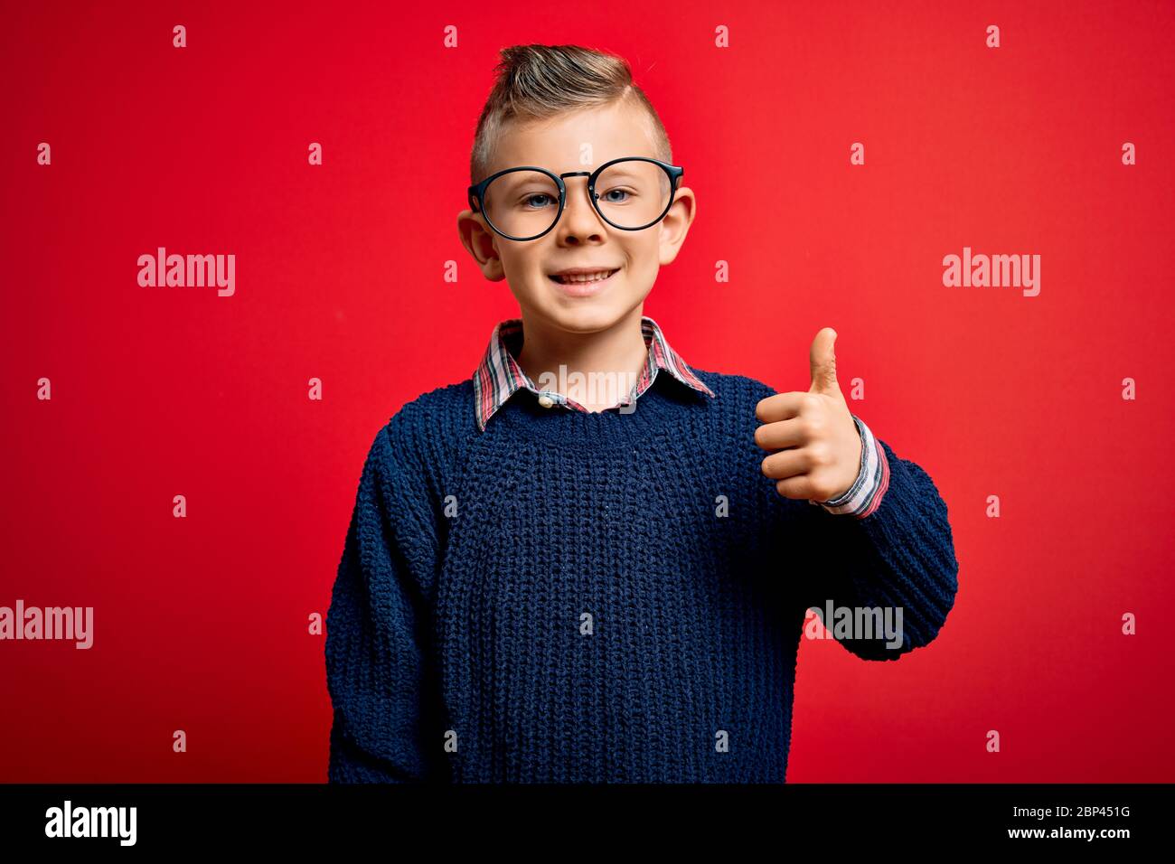 Young little caucasian kid with blue eyes standing wearing smart ...