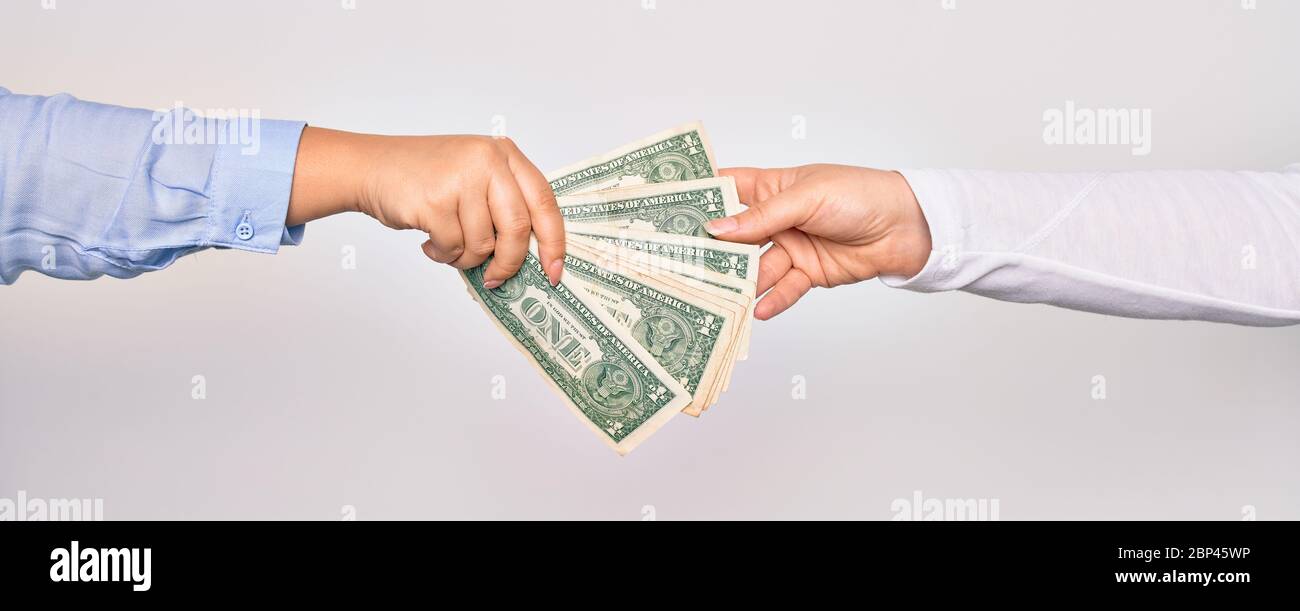Two hands of caucasian young women doing transaction. Woman giving ...