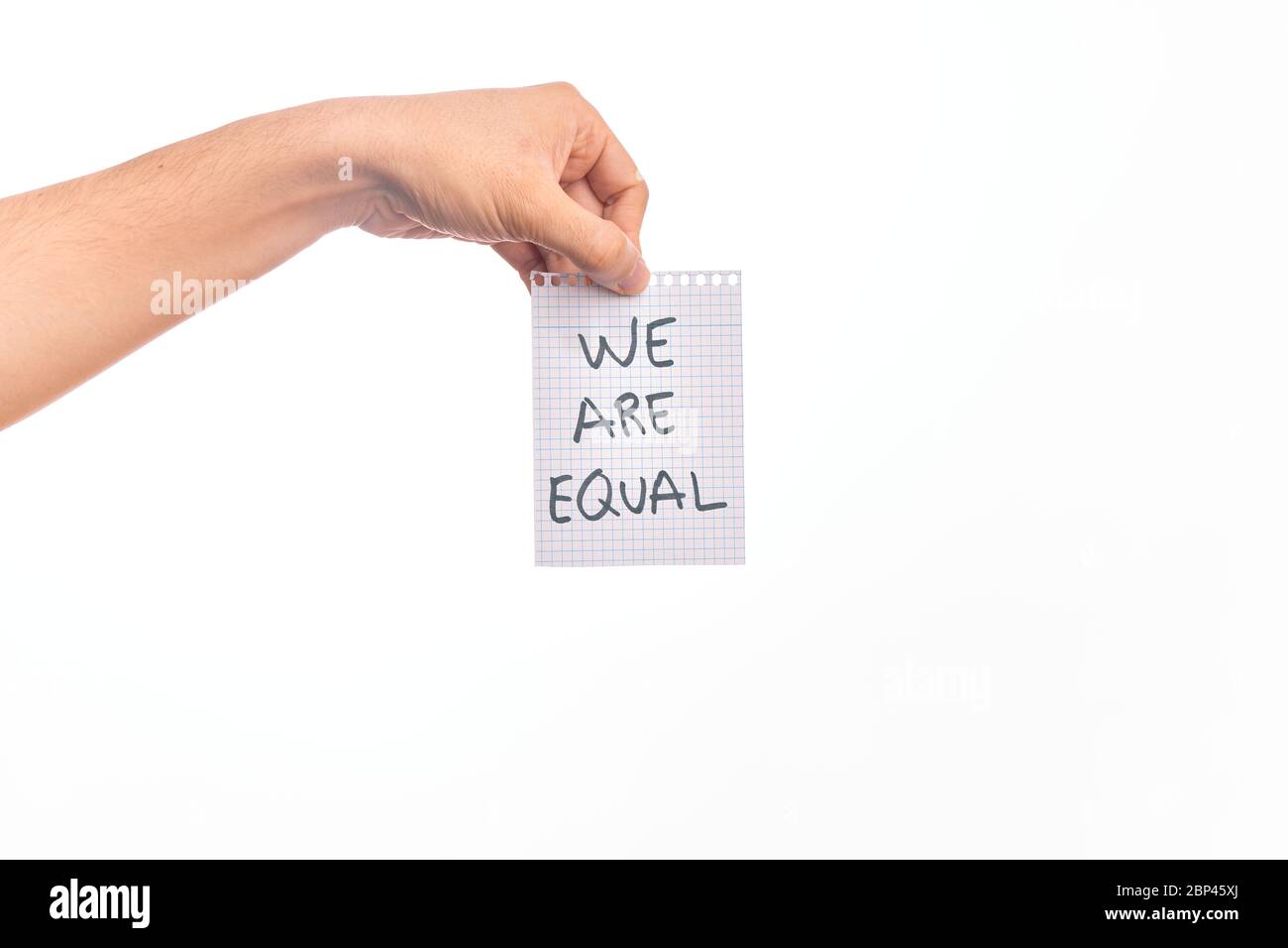 Cardboard banner WE ARE EQUAL, protesting for equal rights over ...