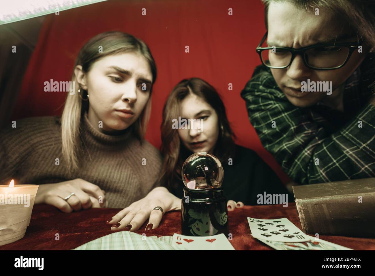 Group of people and woman fortune teller with crystal ball Stock Photo ...