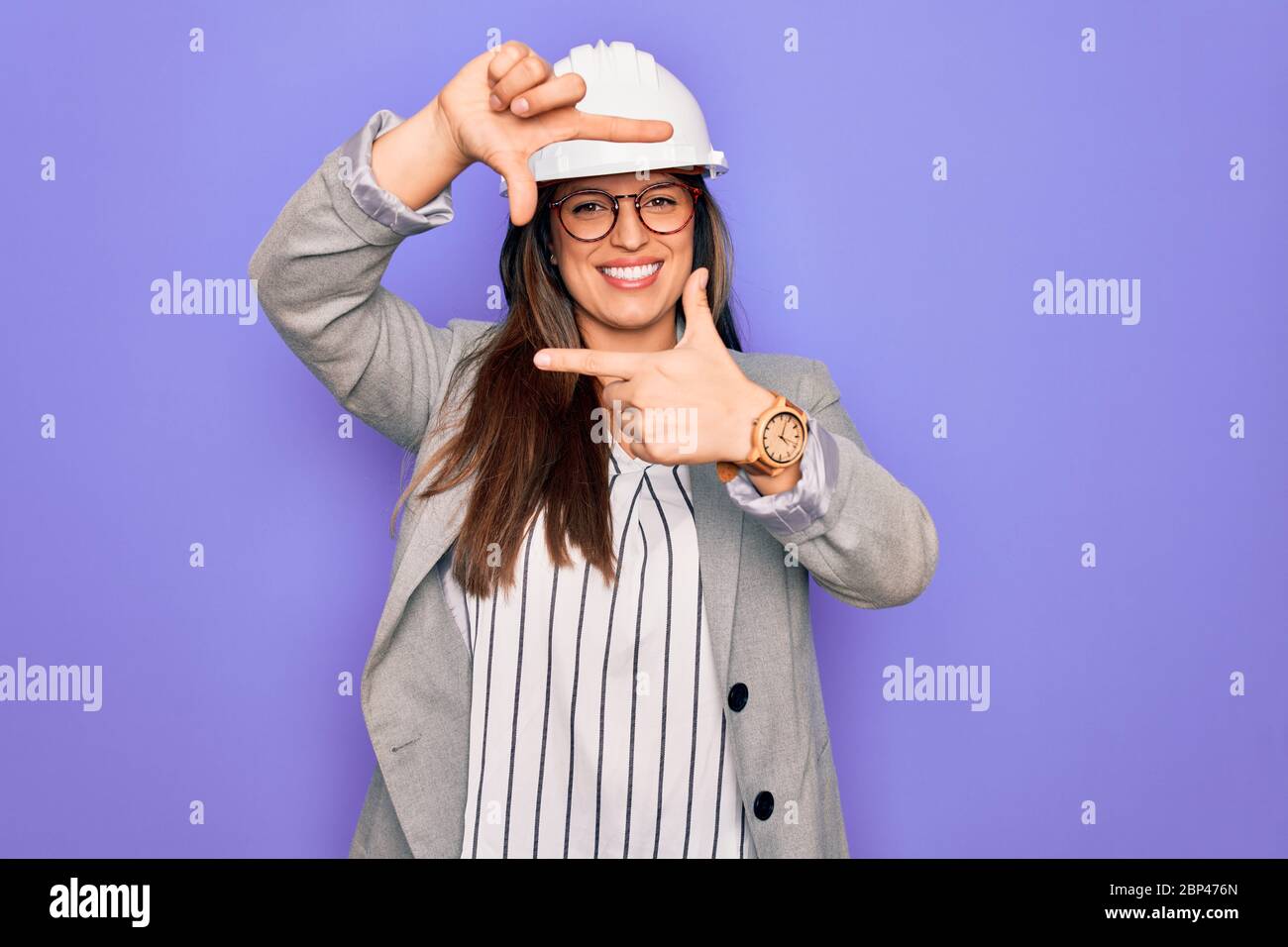 Professional woman engineer wearing industrial safety helmet over ...