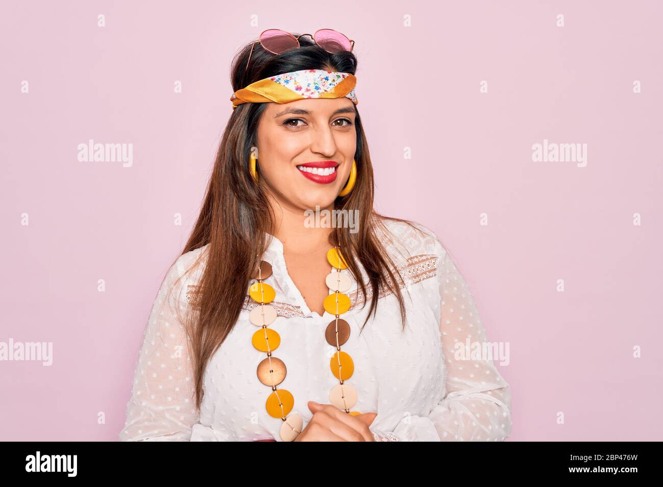 Young hispanic hippie woman wearing fashion boho style and sunglasses ...