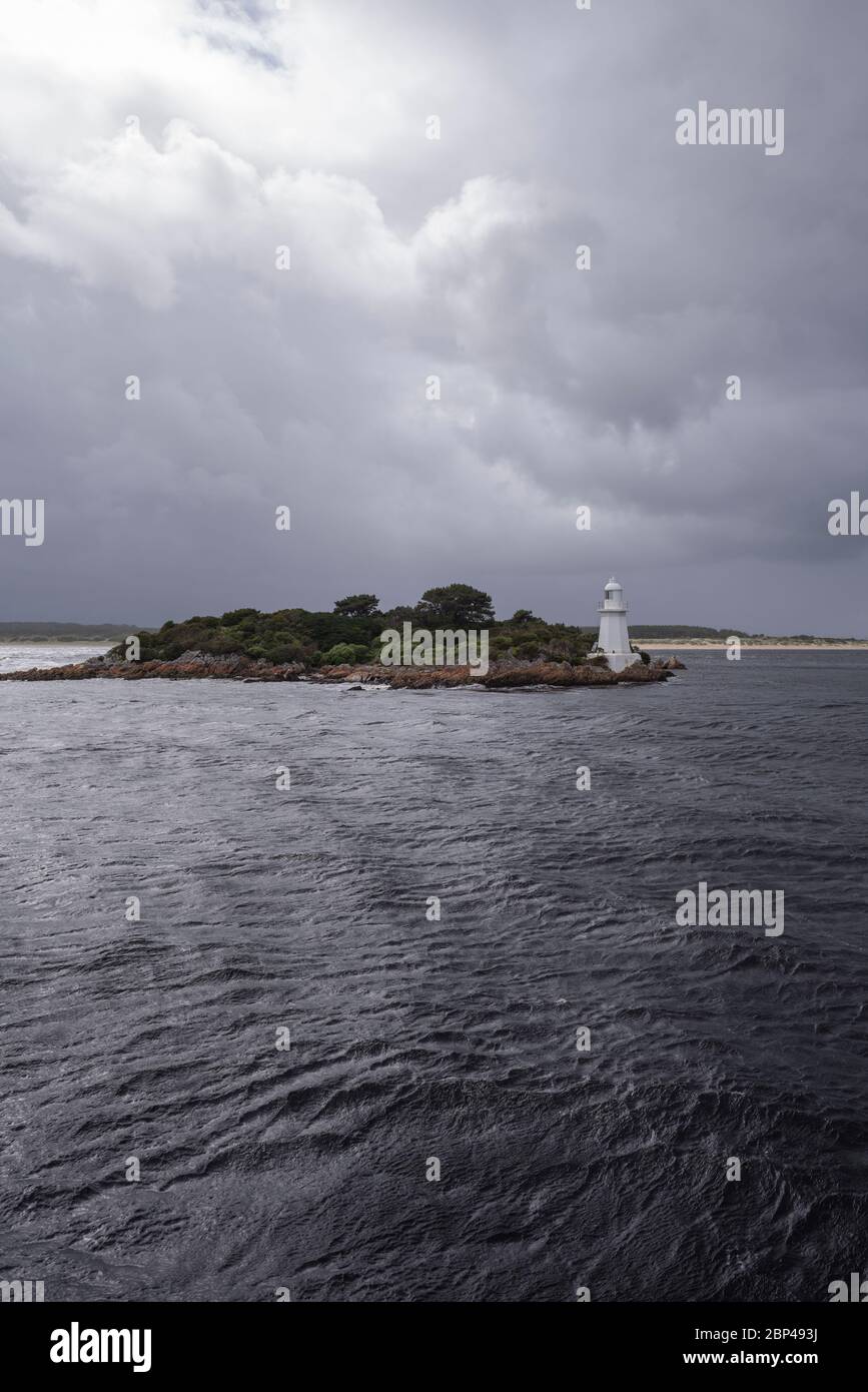 A lighthouse at the narrow entrance to Macquarie Harbour, known as ...