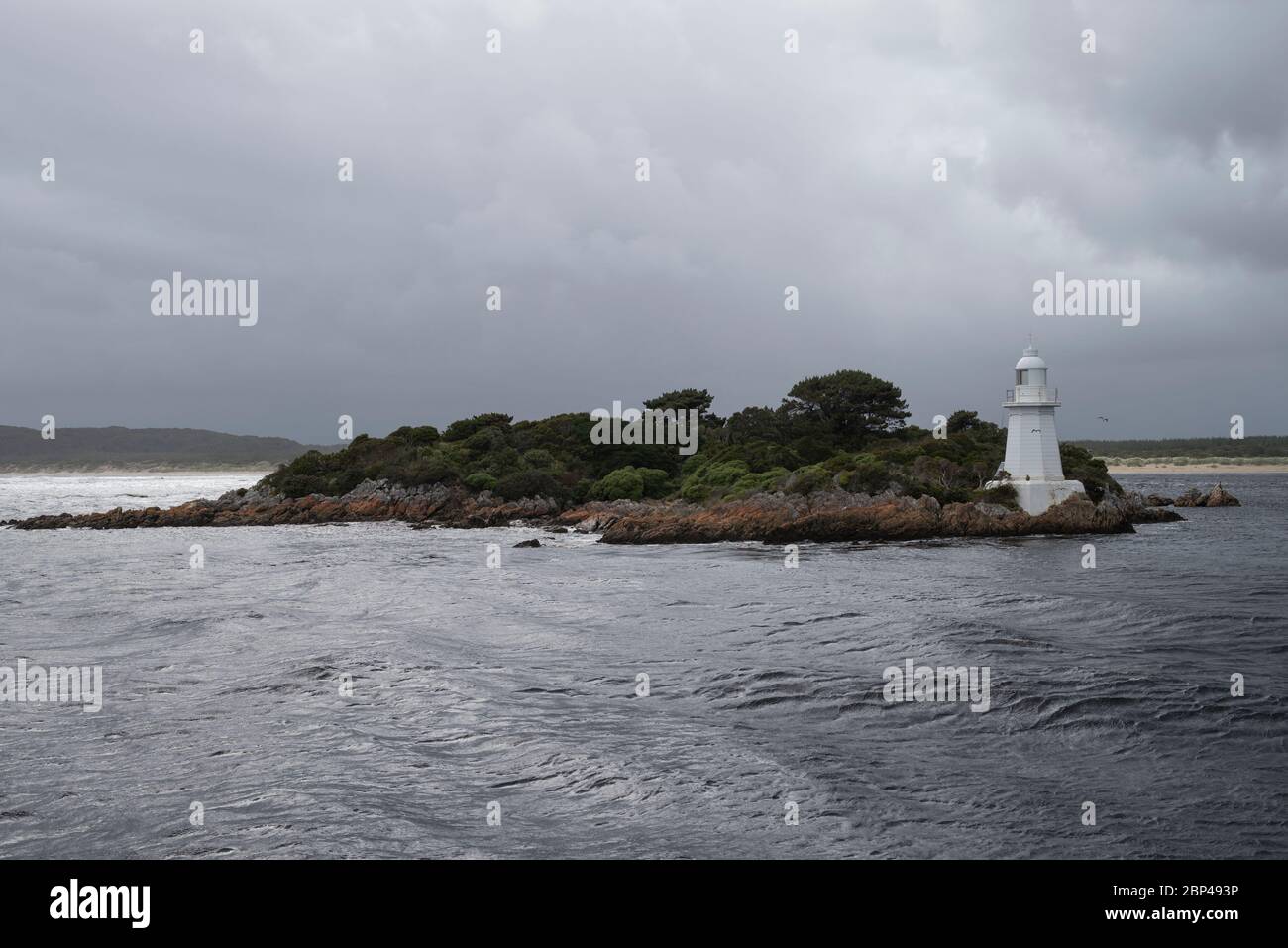 A lighthouse at the narrow entrance to Macquarie Harbour, known as ...