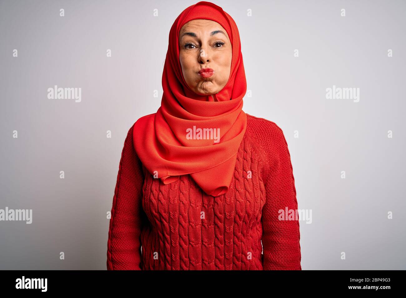 Middle age brunette woman wearing muslim traditional hijab over ...