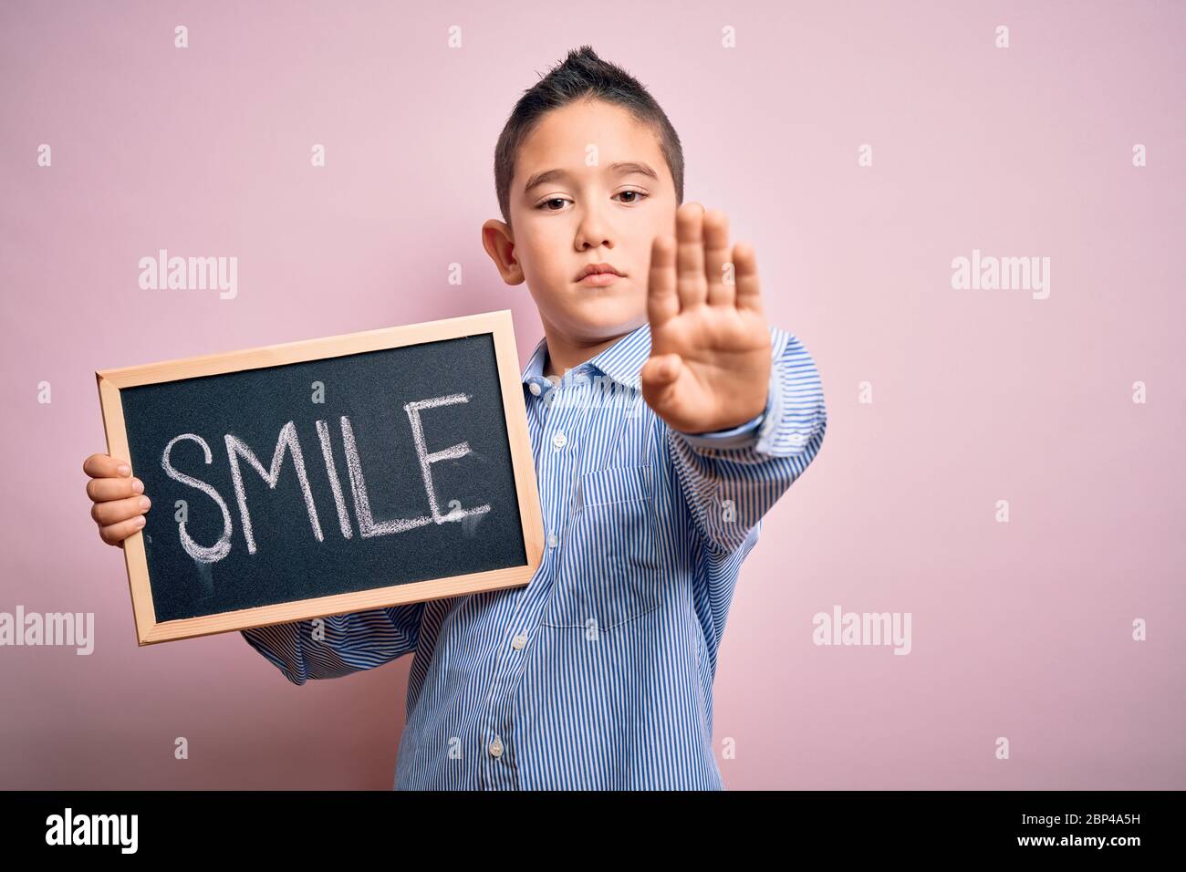 Young little boy kid showing blackboard with smile word as happy ...