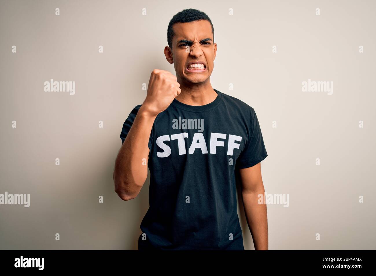 Young handsome african american worker man wearing staff uniform over ...