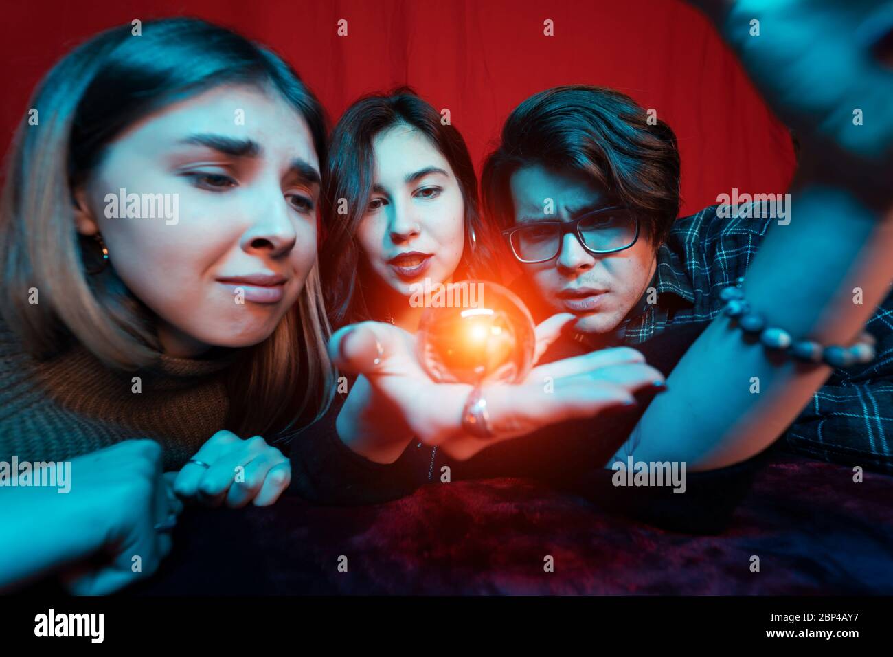 Group of people and woman fortune teller with crystal ball Stock Photo ...