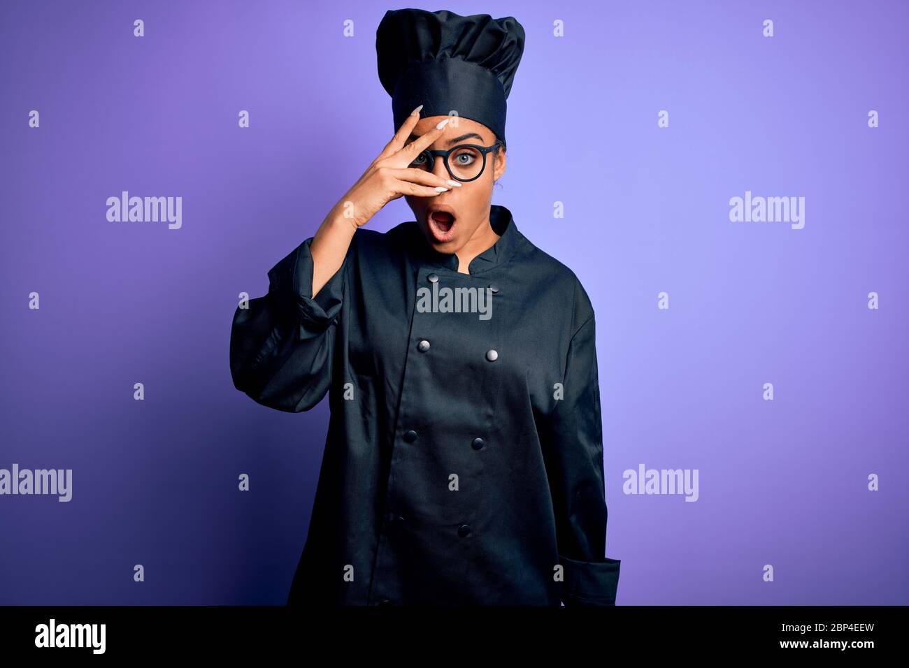 Young african american chef girl wearing cooker uniform and hat over ...