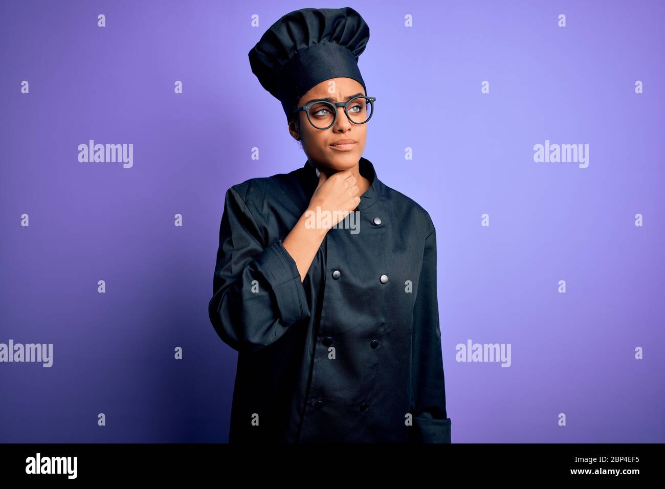 Young african american chef girl wearing cooker uniform and hat over ...