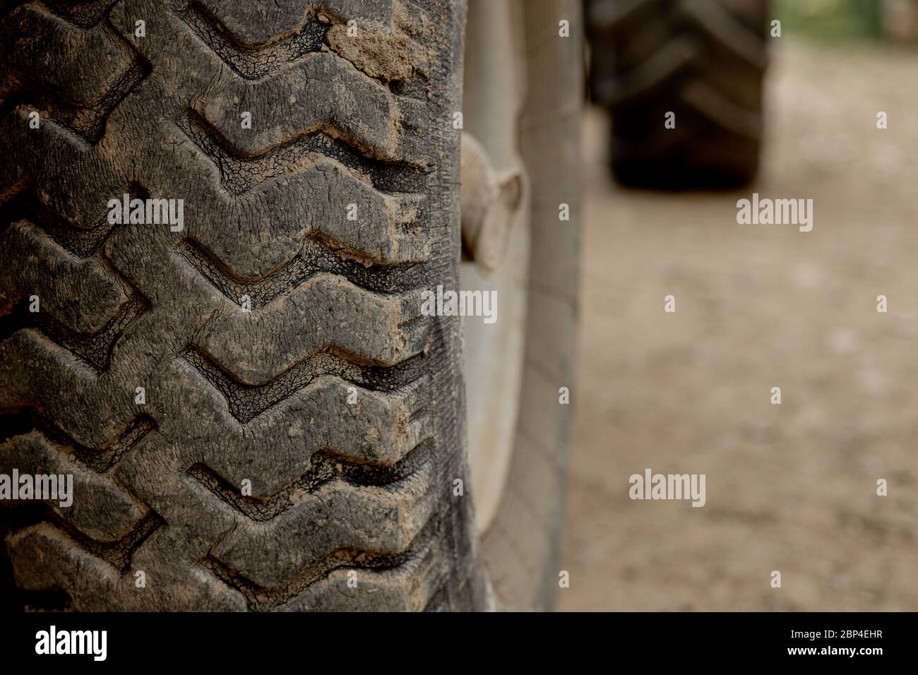 Detail of an old, cracked tractor tire Stock Photo - Alamy