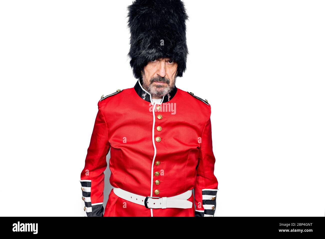 Middle age handsome wales guard man wearing traditional uniform over ...