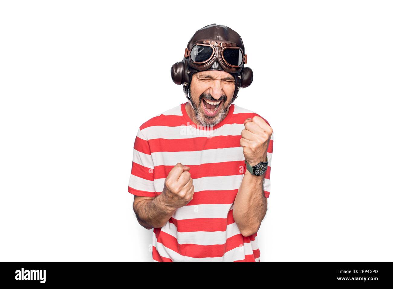 Middle age aviator man wearing vintage helmet and glasses over isolated ...