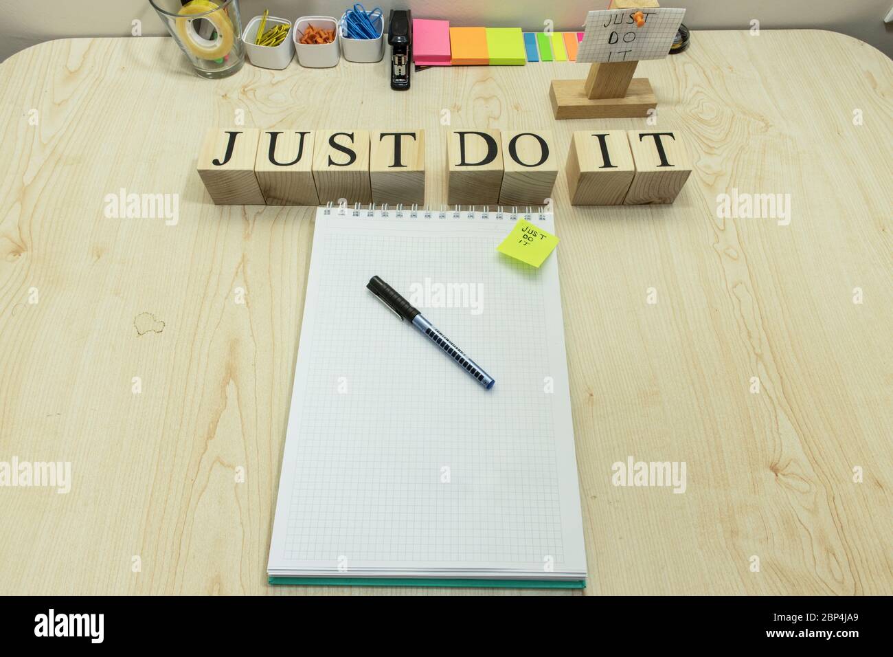 There is a notepad checker and pencil on the table. On the right, it ...