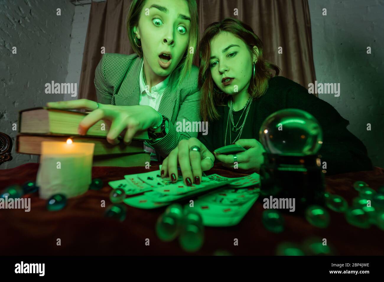 Fortune teller forecasting the future to woman with cards Stock Photo ...